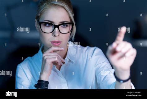 Thoughtful Female Programmer Working On The Project In The Office Stock