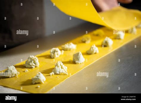 Preparing Fresh Made Ravioli With Ricotta Cheese Inside Pasta Factory