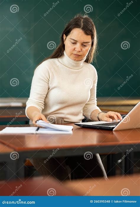 Portrait Of A Concentrated Girl Student Preparing For Classes Stock