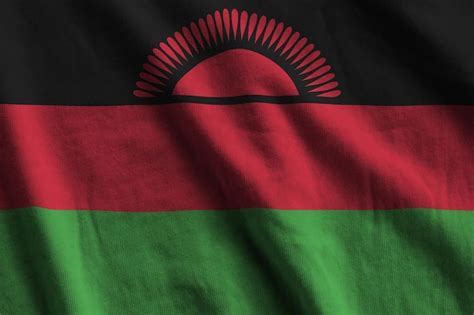 Флаг малави с большими складками развевающимися крупным планом под
