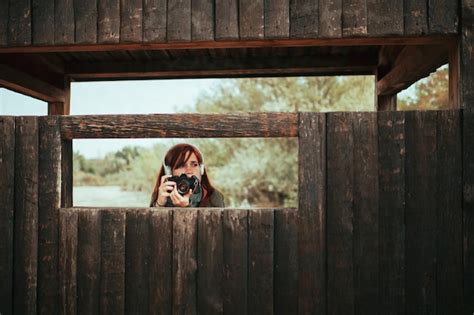 Premium Photo Woman Holding Camera At Observation Point