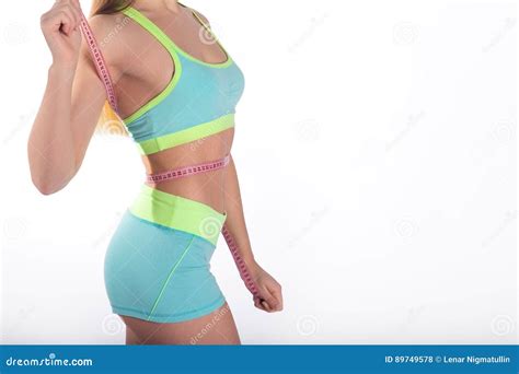 Body Of Fitness Woman With Measuring Tape On Waist Stock Photo Image