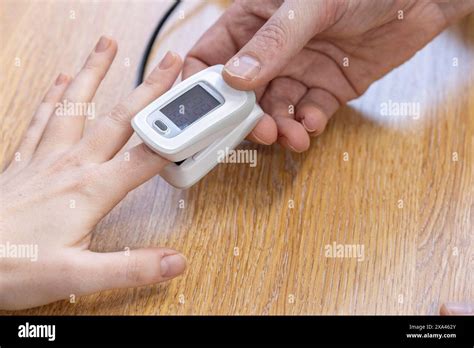 Measuring Oxygen Saturation With A Pulse Oximeter Stock Photo Alamy