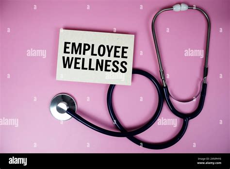 Employee Wellness Program Text With Stethoscope On Pink Background Healthy And Wellness Concept