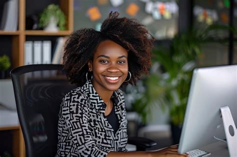 Premium Photo Smiling Woman Sitting At Her Desk In Office Happy