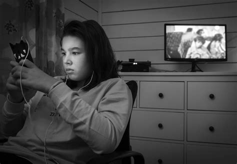 Premium Photo Teenage Girl Using Phone While Sitting At Home