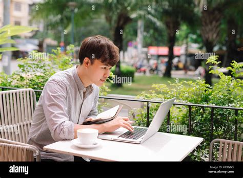 Young Male Freelancer Working With Laptop Computer In Comfortable