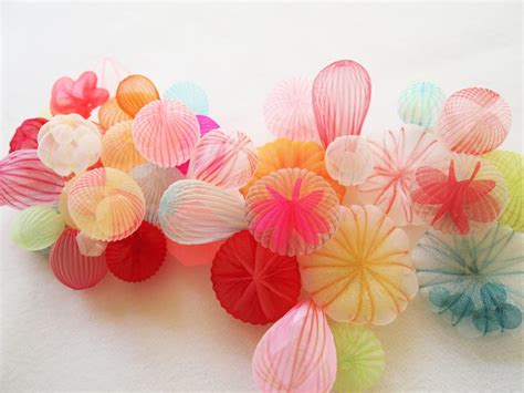 Ethereal Sculptures And Wearable Orbs Formed From Synthetic Fabric By