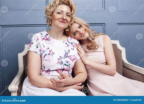 Lifestyle People Concept Mature Blond Mother With Teenage Daughter At