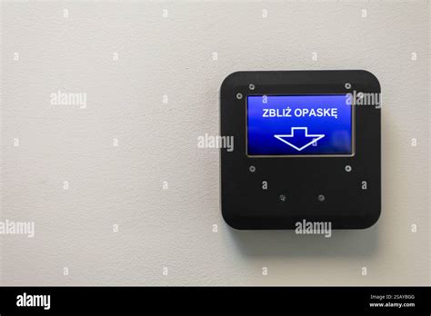 Elevator Control Panel That Features A Down Arrow Indicator For User Convenience And Navigation
