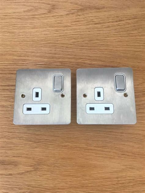 MK Brushed Chrome Single Electric Sockets With White Infill And Flat Plate In Exeter Devon