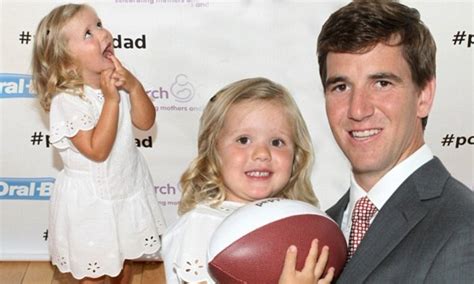 Nfl Star Eli Manning Proudly Holds Adorable Daughter Ava Close At