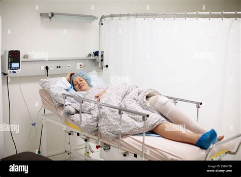 Young Patient Recovering After Surgery In Post Operative Care Room In