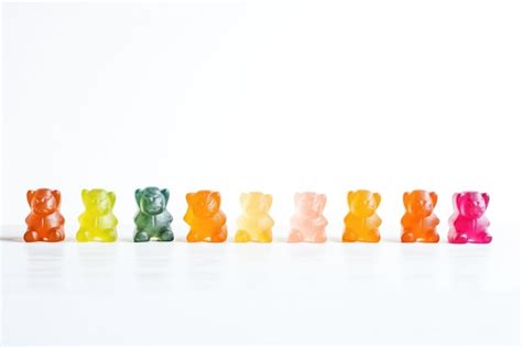 Premium Photo Rainbow Gummy Bears Lined Up In Color Order On White