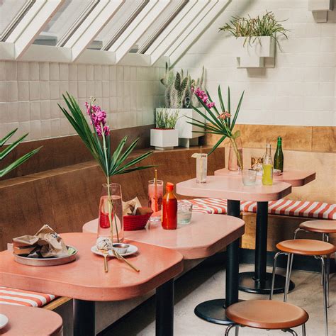 Green And Yellow Eames Chairs Fill Tacofino Ocho Restaurant In Vancouver