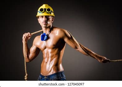 Стоковая фотография Nude Builder Pulling Rope Darkness Shutterstock