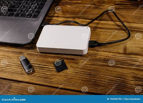 External Hdd Connected To Laptop Computer Sd Memory Card And Usb Flash