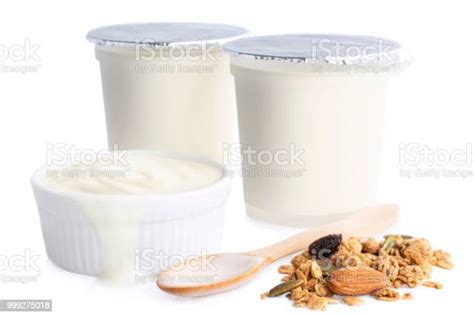 Healthy Flavored Yogurt In Plastic Cup And Ceramic Bowl With Cereal And
