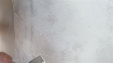 Applying Decorative Putty White Abstract Texture Of Surface Covered