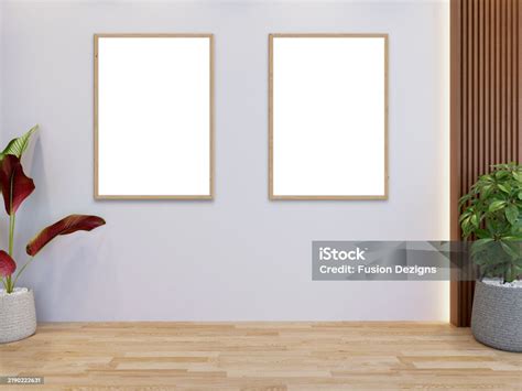 빈 액자 모형은 식물 장식 쪽모이 세공 마루 바닥 및 나무 질감으로 거실 벽에 매달려 있습니다 프리젠 테이션 사진 미술관 포스터에 대 한 모형 모던한 인테리어 디자인 0명에