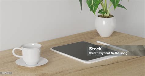 흰색 배경이 있는 3d 렌더링 작업 데스크 태블릿 연필 녹색 식물과 나무 테이블에 커피 컵 최소한의 작업 영역 벽 인테리어