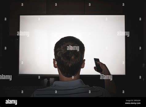Man Watching Television Turning On Plasma Flatscreen TV Set Pointing