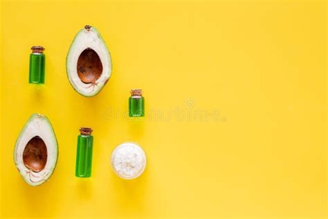 Cosmetics For Skin Care Avocado Oil Near Half Of Avocado On Yellow