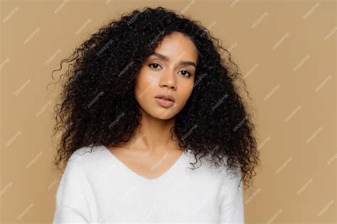 Premium Photo Portrait Of Serious Beautiful Dark Skinned Female With