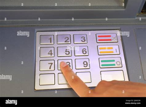 Hand Of People Typing Secret Code On Numeric Keypad Without Being Seen