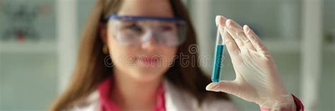 Woman Scientist Chemist Holding Test Tube With Blue Liquid In Chemical Laboratory Closeup Stock