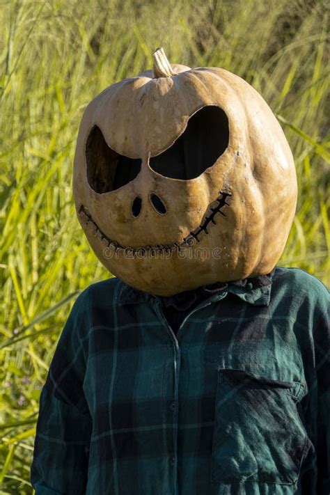 Young Woman With Pumpkin Head After Cutting It Off And Putting A Face