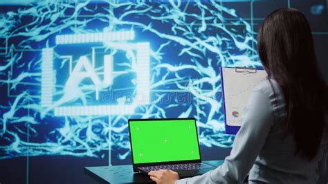 Startup Employee Looking Over Charts Using Ai Software On Green Screen Laptop Stock Image