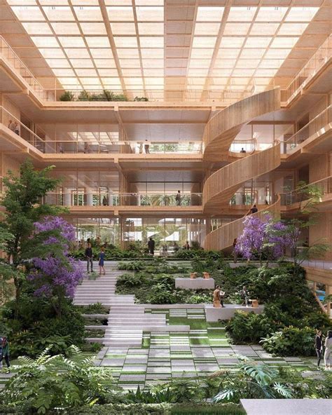 An Atrium With Plants And People Walking Around