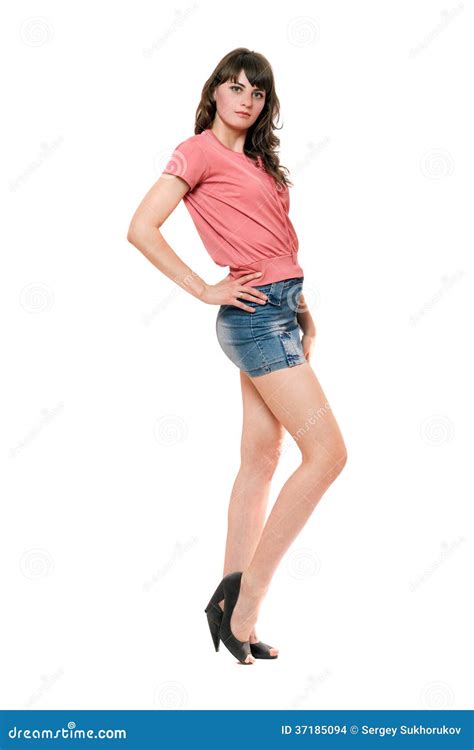 Menina Bonita Na Mini Saia Das Calças De Brim Isolado Foto De Stock