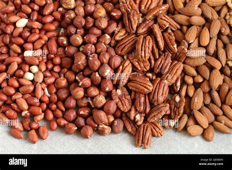 Raw Peeled Peanuts Hazelnuts Pecans Almonds And Walnuts On A Linen