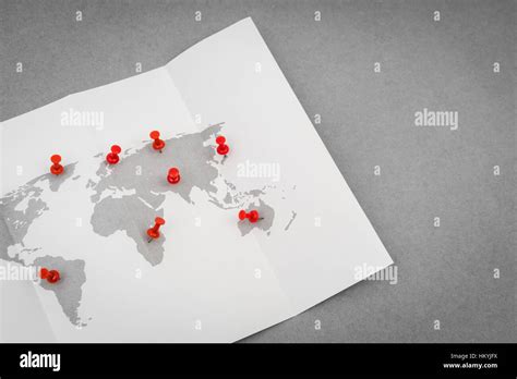 Paper Folded World Map With Red Pin Pointer Stock Photo Alamy
