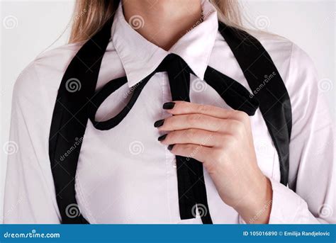 Elegant Woman With Tie Around The Neck And Holds With Hand With Black