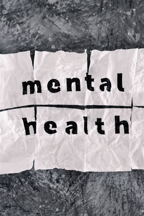 Mental Health Text On Crumpled And Torn Piece Of Paper Which Has Been Reassembled With Sticky