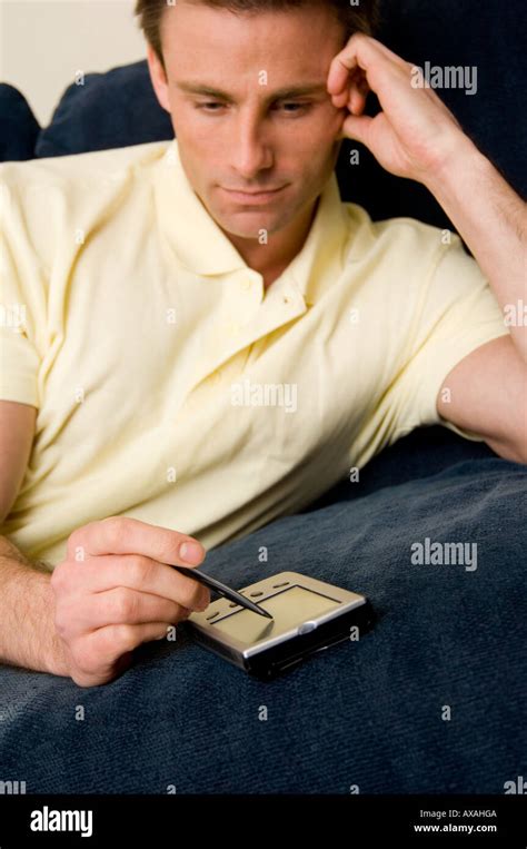 Man Using A PDA Stock Photo Alamy