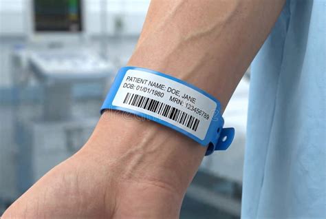 Close Up Of A Wrist Wearing A Hospital Identification Wristband With