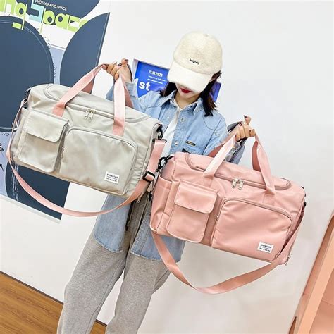 Bolsa de viagem portátil feminina de grande capacidade impermeável leve