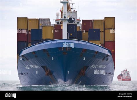 A View Of The Bow Of A Container Ship Moving Through The Water At Close
