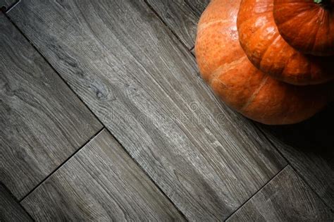 Stack Of Pumpkins On Wood Planks Background For Halloween Theme Stock