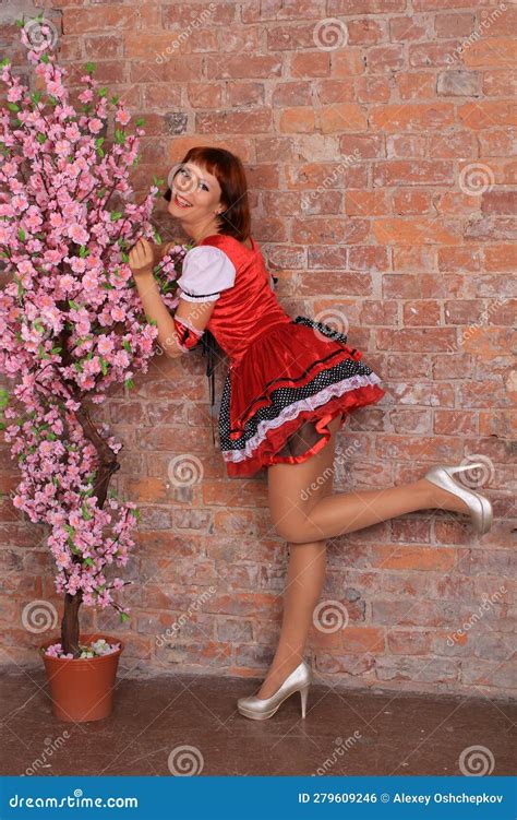 Long Legged Redhead Girl In Red Minidress And Shiny Pantyhose Stock Photo Image Of Posing
