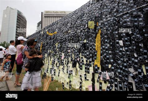 South Koreans Put Mourning Messages And Stickers On A Board For The