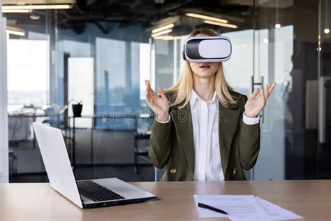 Businesswoman Exploring Virtual Reality In Modern Office Stock Image