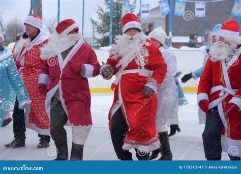 Many Santa Clauses And Snow Maidens Dance Together A Flash Mob