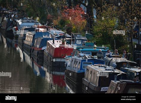 Canal Boat Owners Enjoying Enjoy A Drink In The Late Afternoon Sunshine
