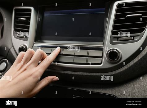 Woman Tuning Radio In Car Closeup Stock Photo Alamy