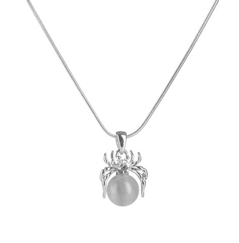 Premium Photo Pendant In Form Of Spider With Pearl Isolated On White